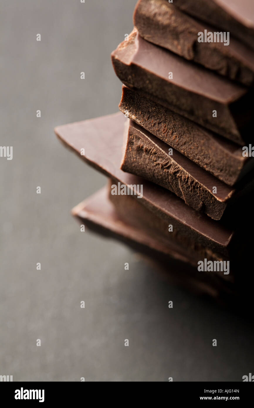 Stack of dark chocolate pieces hi-res stock photography and images - Alamy
