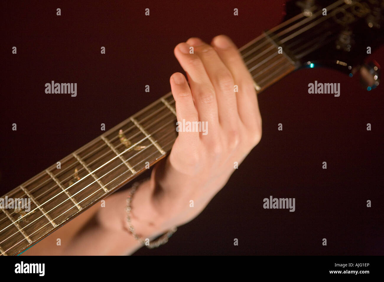 Young man playing electric guitar on stage Stock Photo - Alamy