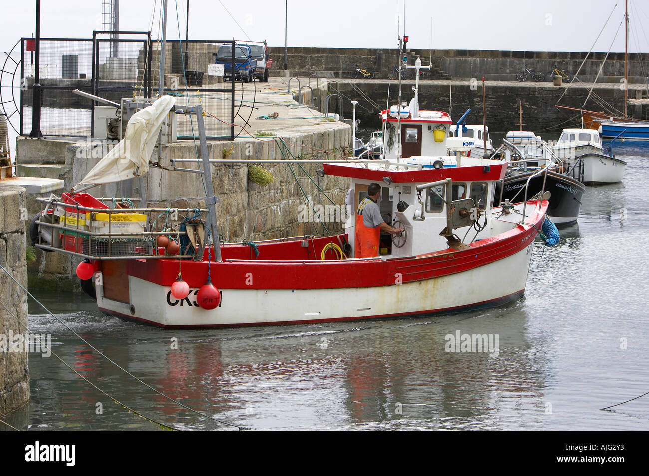 small fishing boat enters annalong harbour county down northern ireland ...