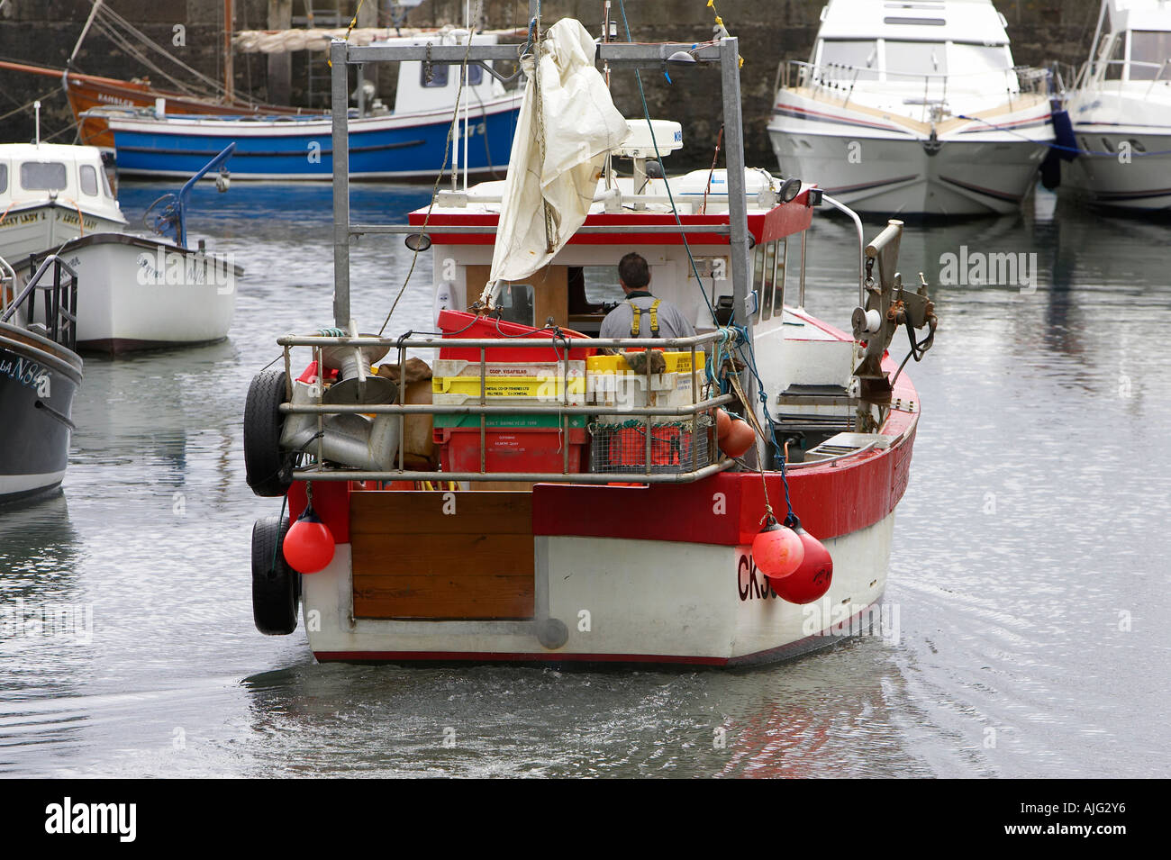small fishing boat enters annalong harbour county down northern ireland ...
