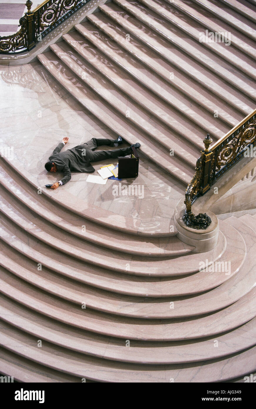 Concept photo of a businessman having fallen down the stairs Stock ...