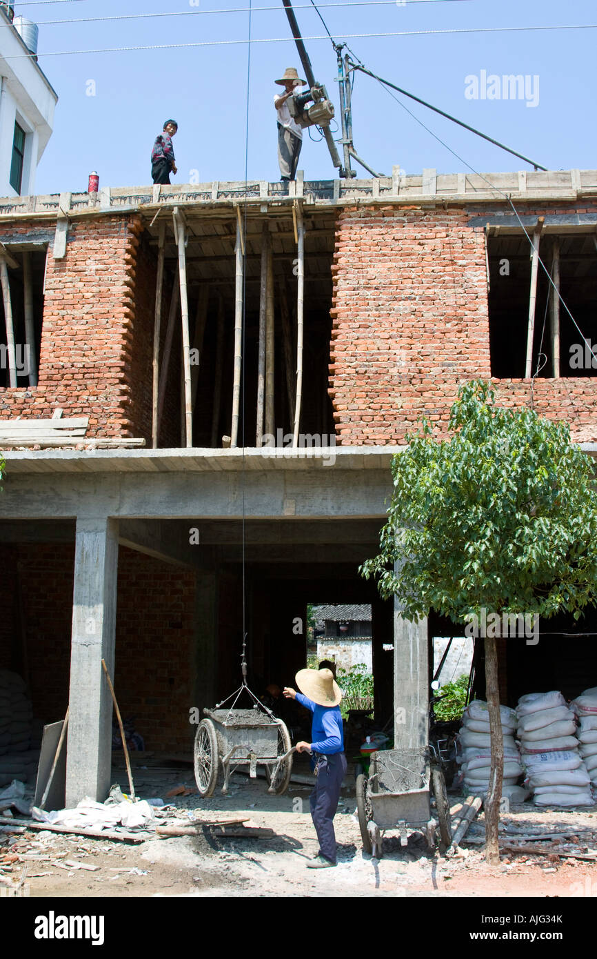 Chinese Construction Workmen Lifting Concrete in Likeng Wuyuan China ...