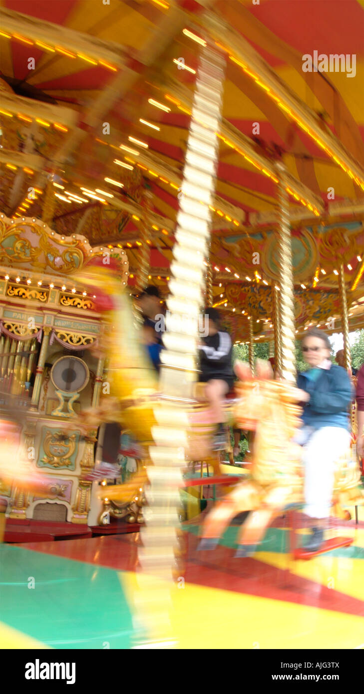 Carousel Merry go round blurr Stock Photo - Alamy