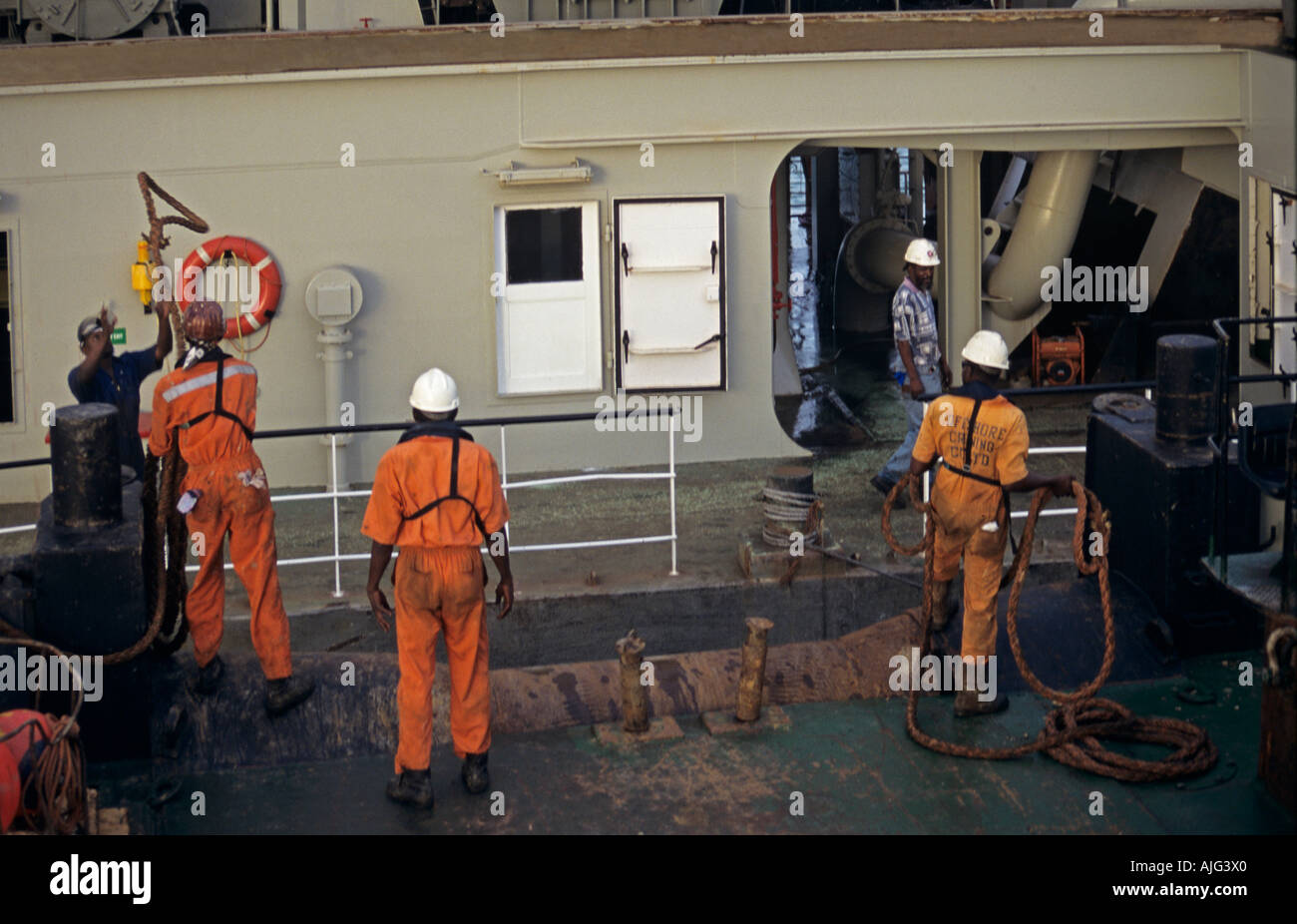 Tying up docking making secure hard hats overalls hi-res stock ...