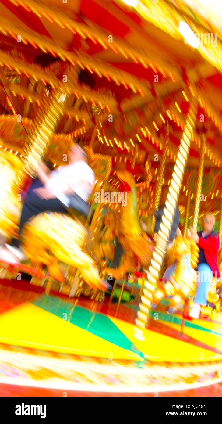 Carousel Merry go round blurr Stock Photo - Alamy