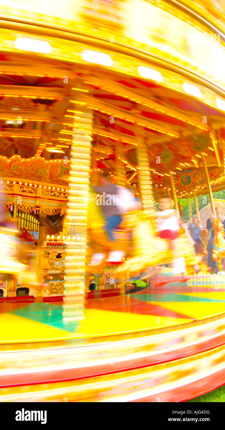 Carousel Merry go round blurr Stock Photo - Alamy