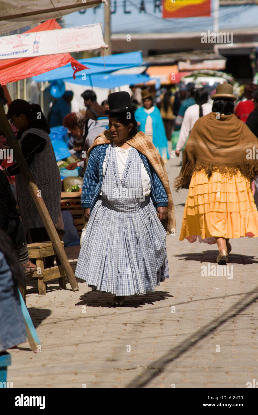 Aymara people and a food stall in the market district of La Paz ...