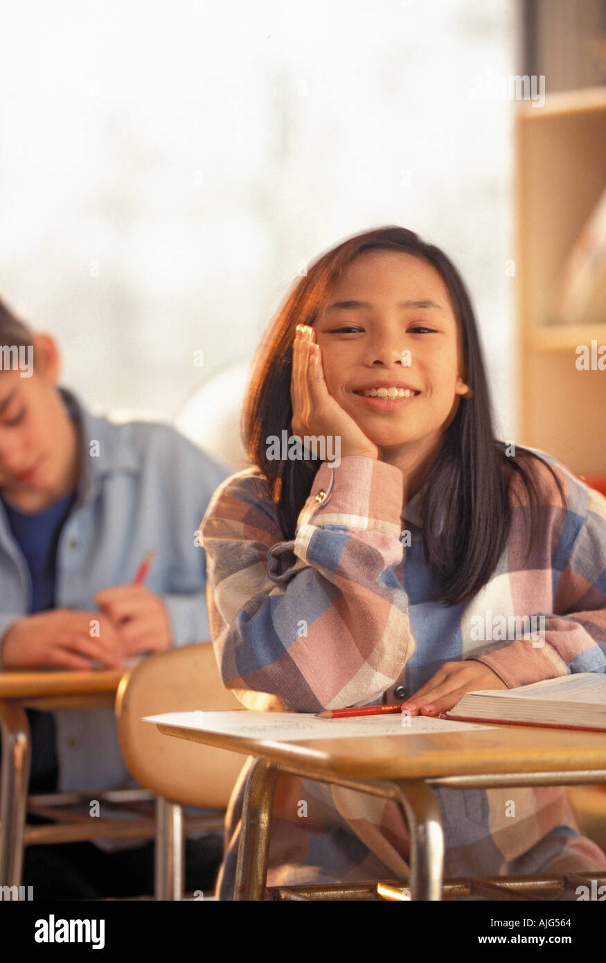 Portrait Asian American female student Paying attention in middle ...