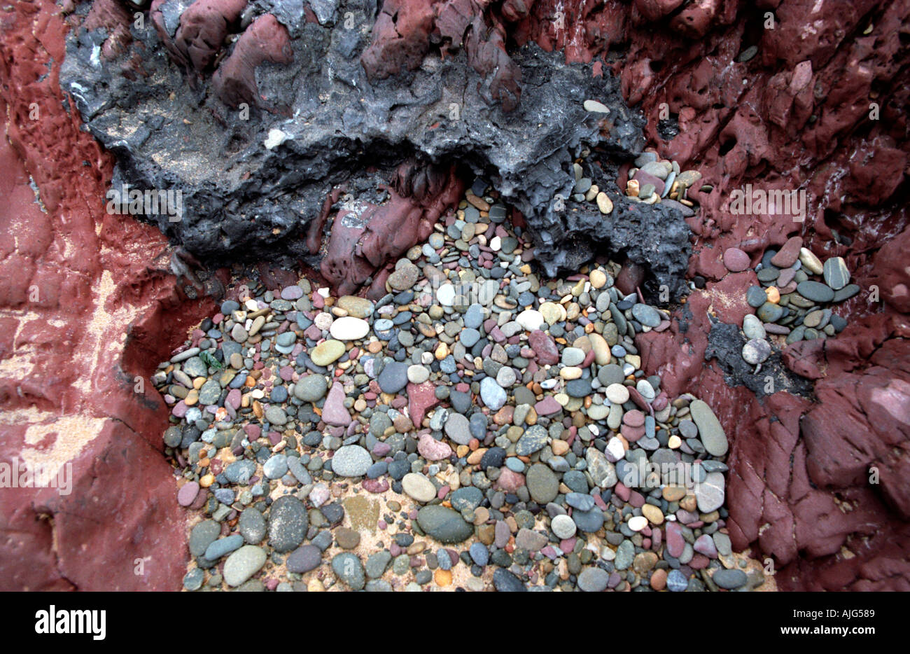 Pebbles and multi coloured rocks on the beach Stock Photo - Alamy