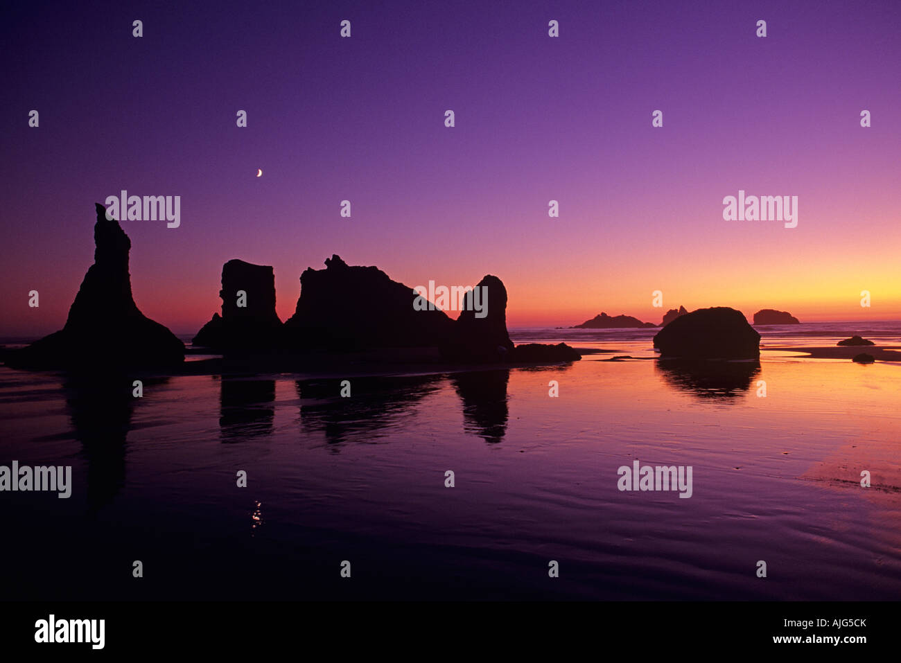 Southern Oregon Coastline sunset with silhouetted rock formations and ...