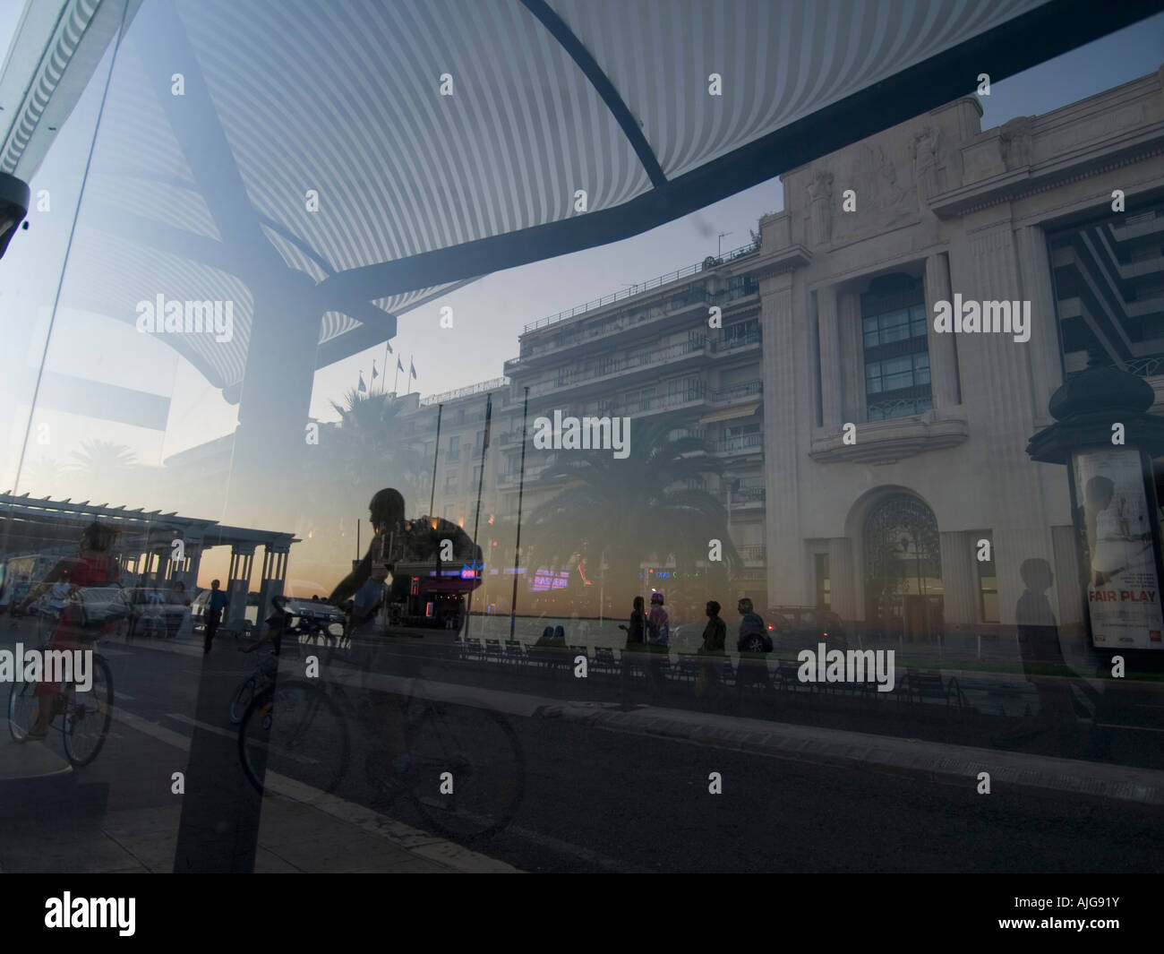Reflection of visitors as they walk and talk in the harbour Stock Photo ...