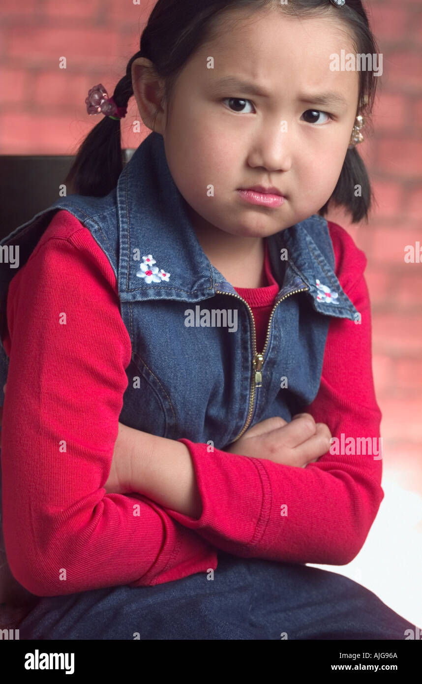 Portrait of a mad, defiant, pouting upset Asian American girl Stock ...