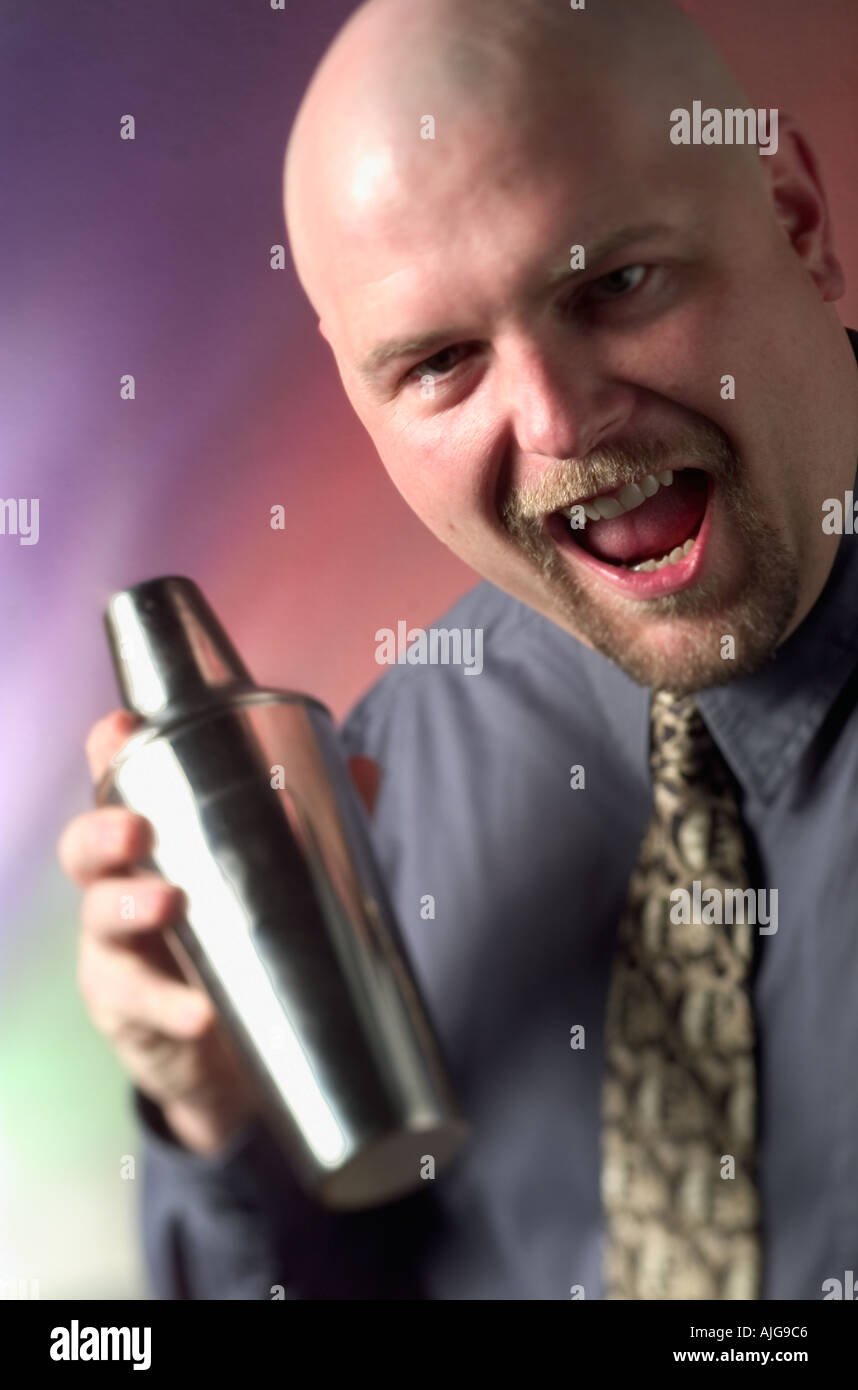 Portrait Caucasian man shaking cocktail Stock Photo - Alamy