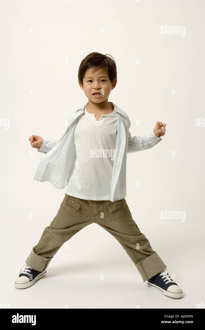 Elementary age boy standing Stock Photo - Alamy