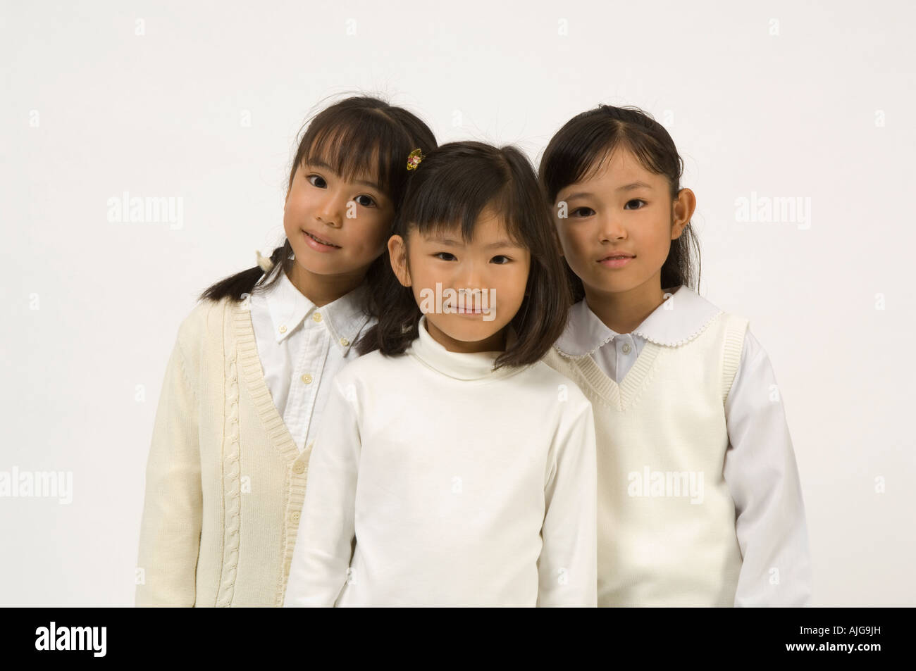 Three elementary age girls Stock Photo - Alamy