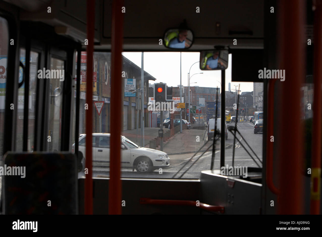 looking along a park and ride bus aisle out the front window towards ...
