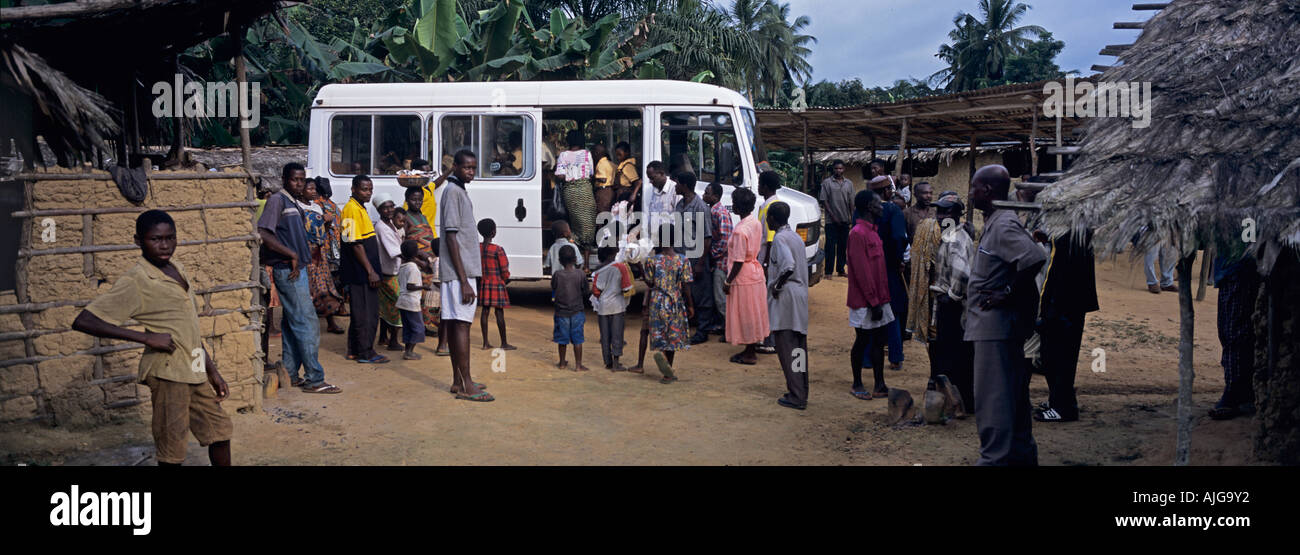 School children getting on school bus Teberebie village Western Ghana ...