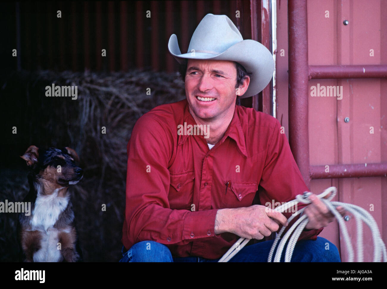 Caucasian Texas cowboy relaxing after ranch roundup Stock Photo - Alamy
