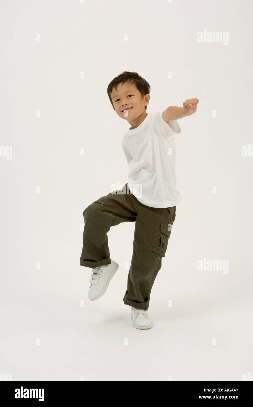 Elementary age boy skipping Stock Photo - Alamy