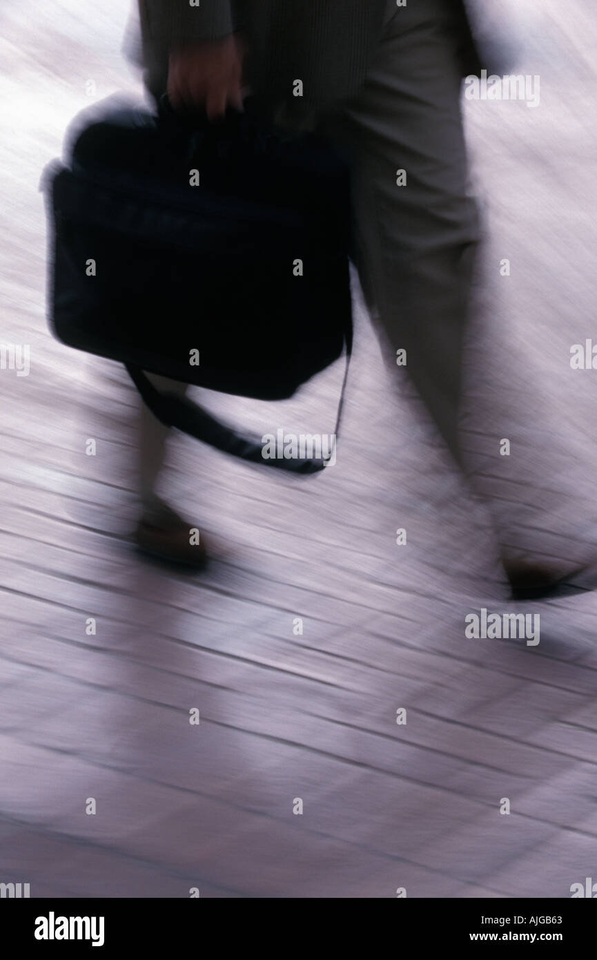 Businessmen rushing down street Stock Photo - Alamy