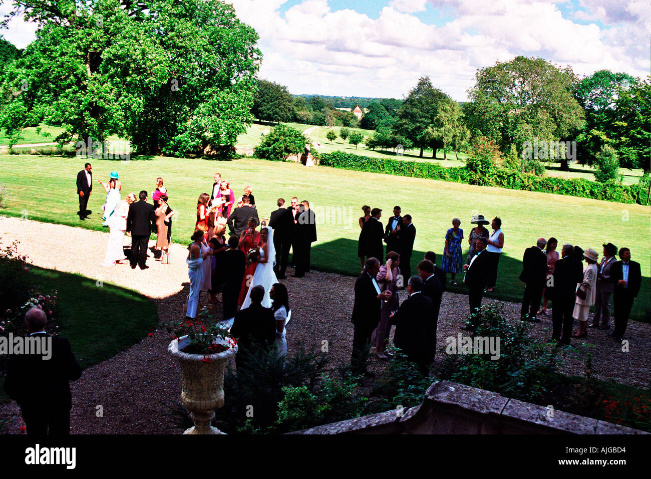 Bride and groom greeting guests at wedding reception Stock Photo - Alamy