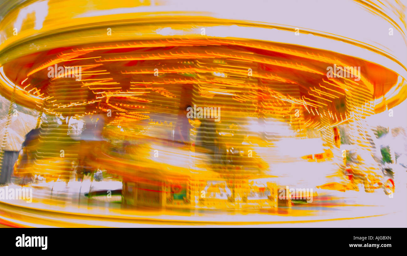 Carousel Merry go round blurr Stock Photo - Alamy