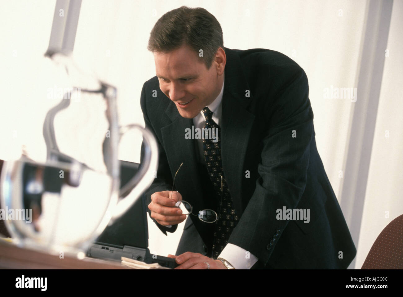 Executive in a meeting going over his notes Stock Photo - Alamy