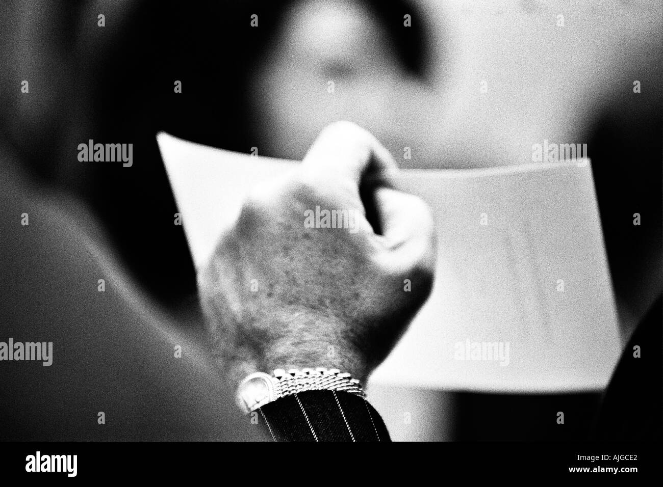 Hand holding a paper Stock Photo - Alamy