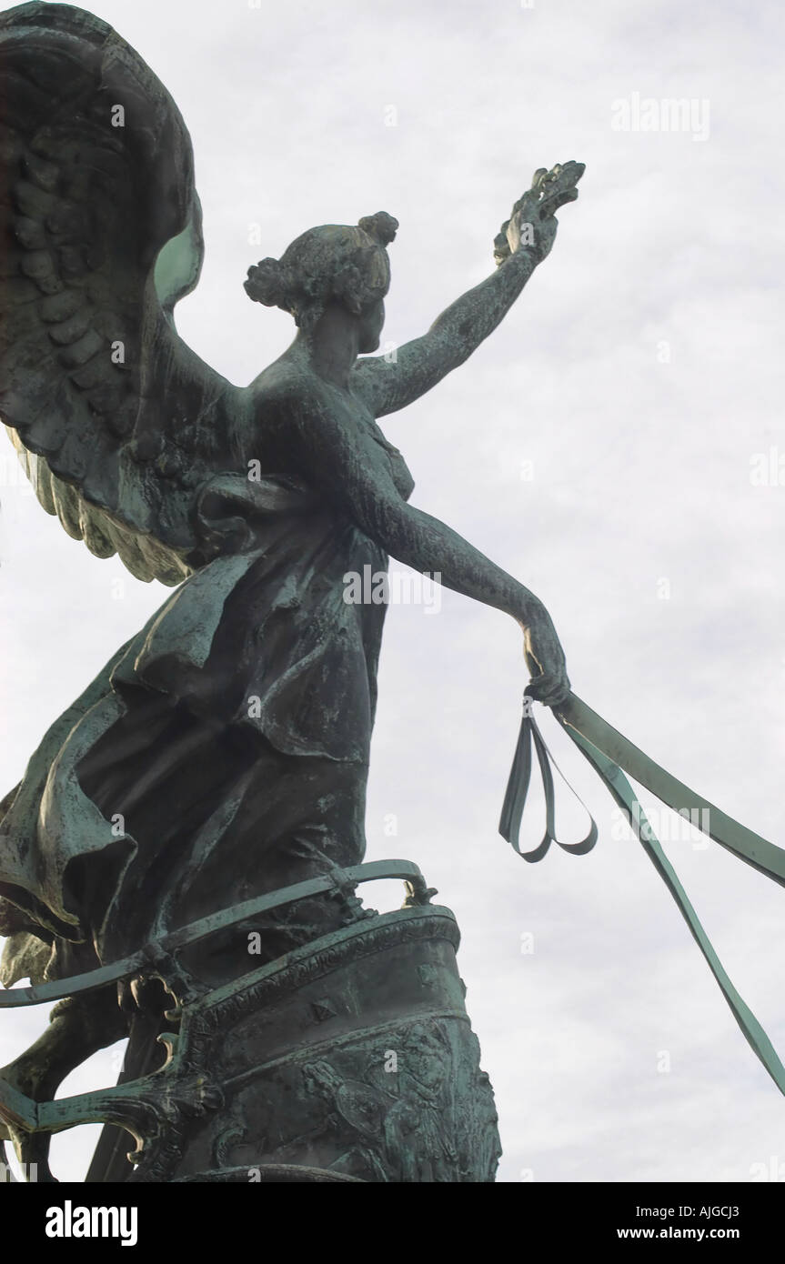 Bronze statue of a winged goddess driving a chariot on the roof of the ...
