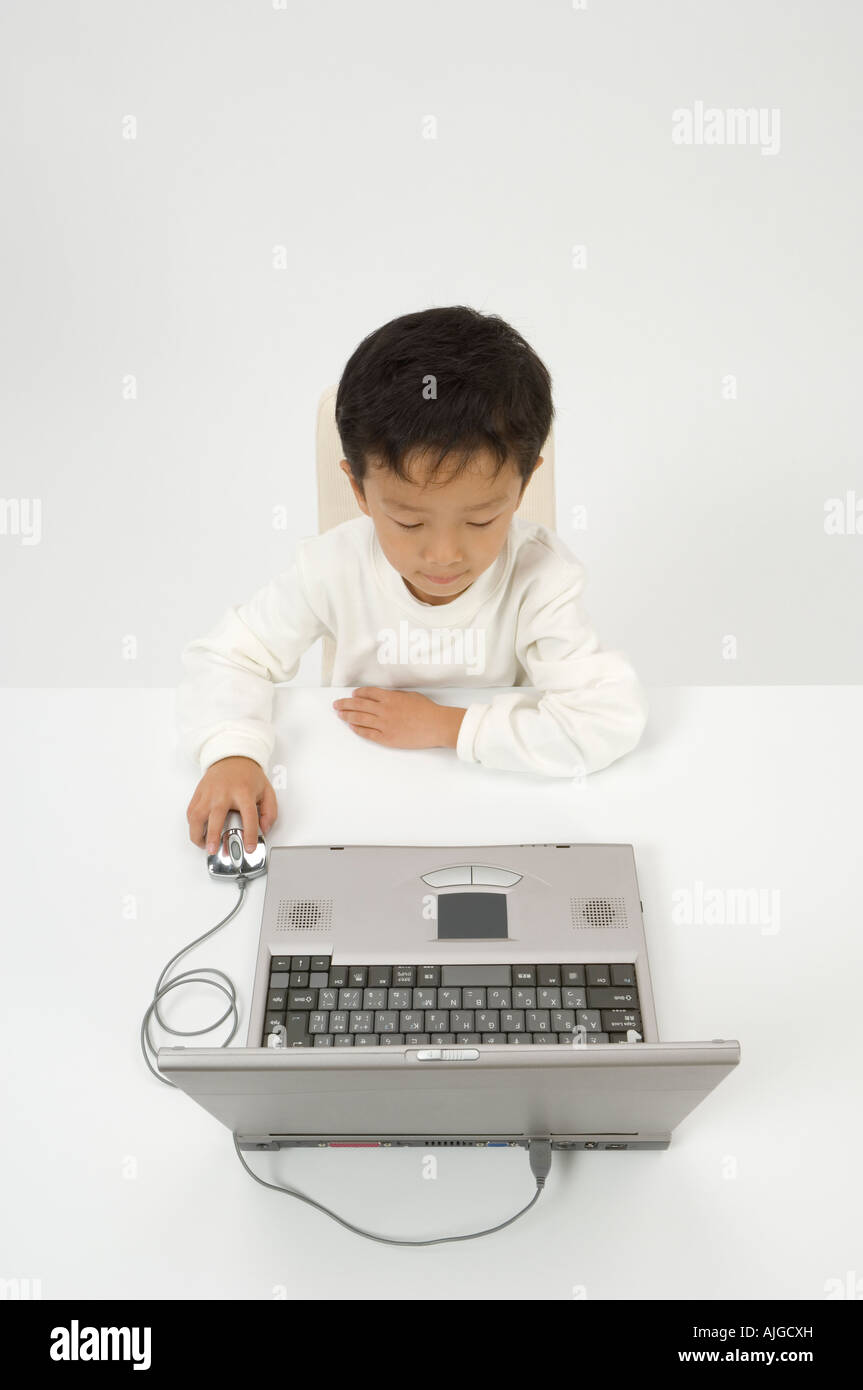 Asian boy computer laptop hi-res stock photography and images - Alamy