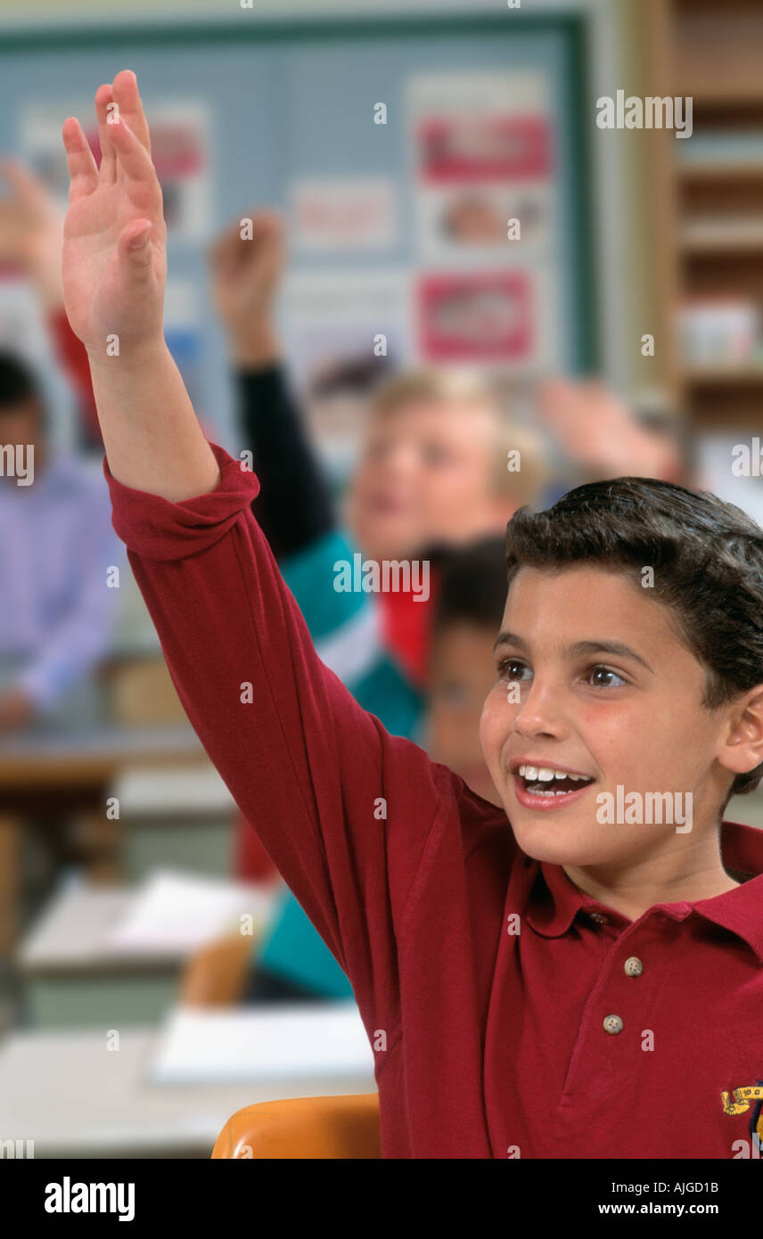 Eager boy raising hand in hi-res stock photography and images - Alamy