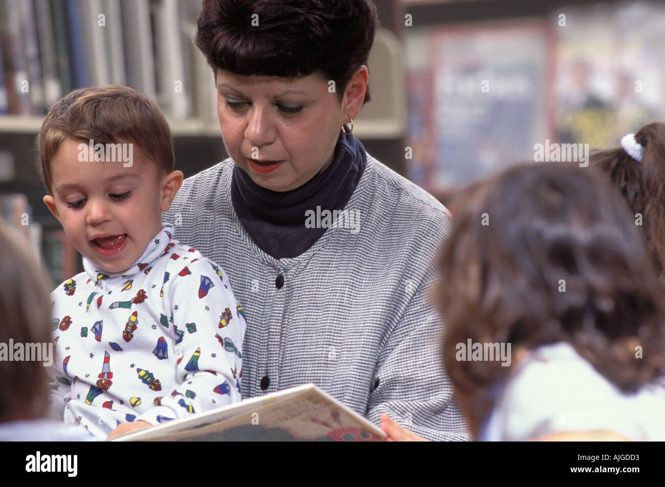 Female teacher reading class preschool hi-res stock photography and ...