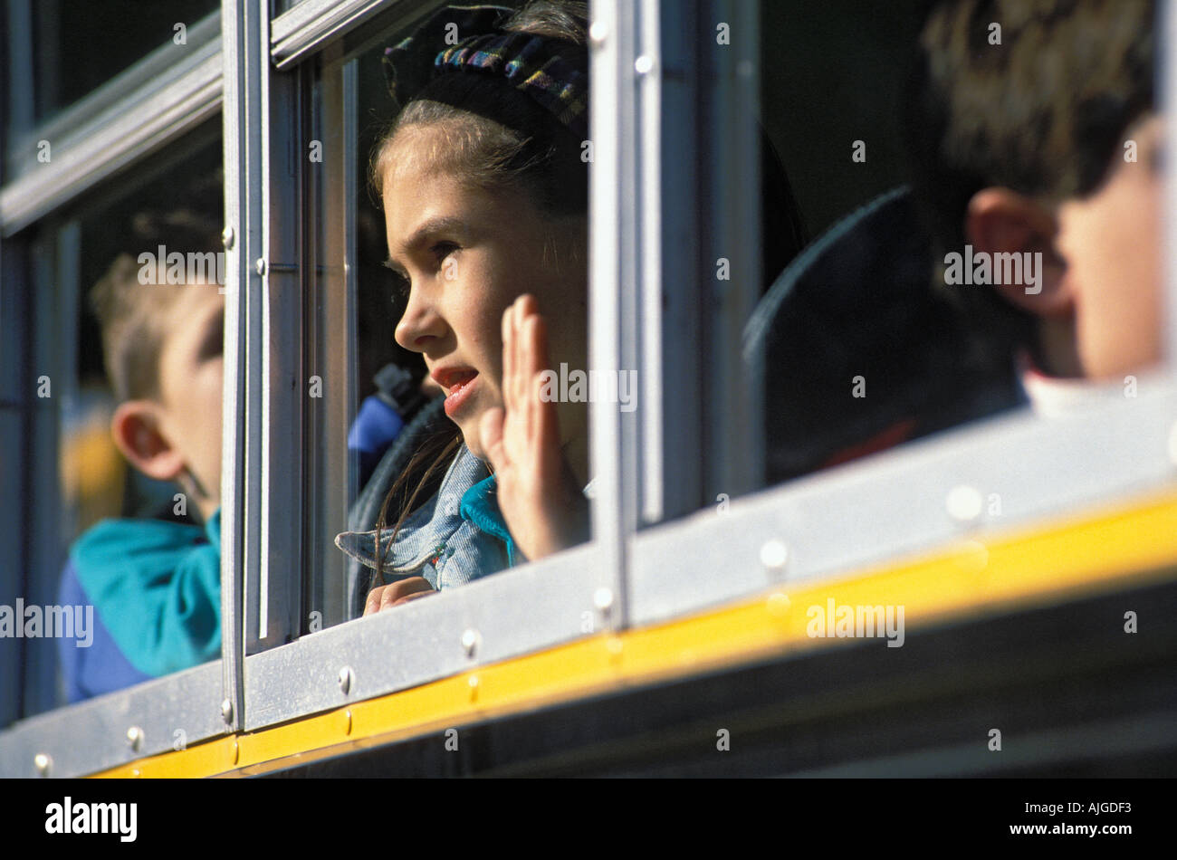 School children riding in a school bus and looking out the window Stock ...