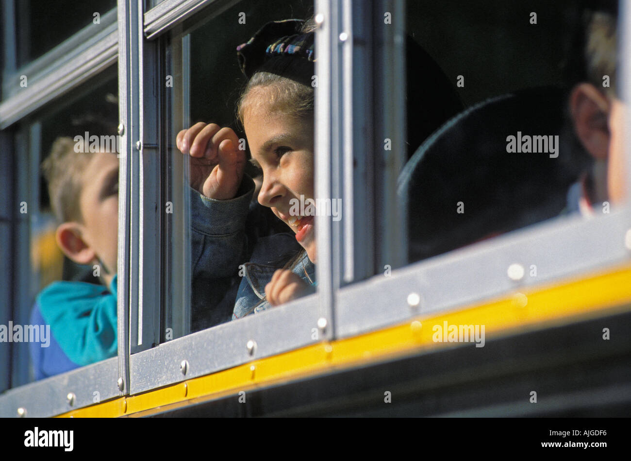 School children riding in a school bus and looking out the window Stock ...