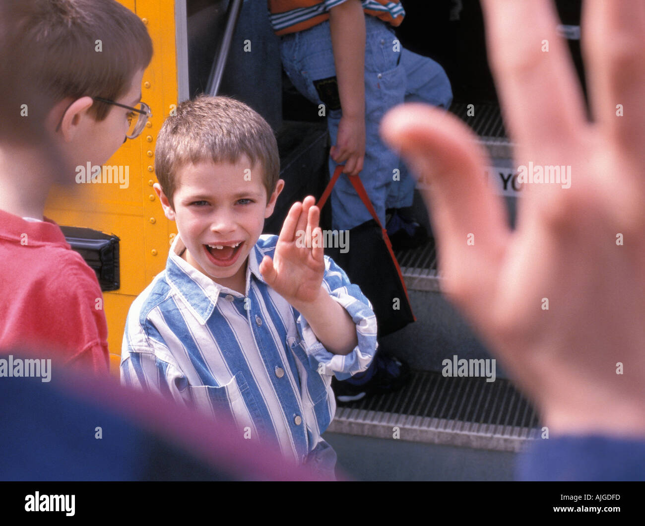 Kids riding school bus to school Stock Photo - Alamy