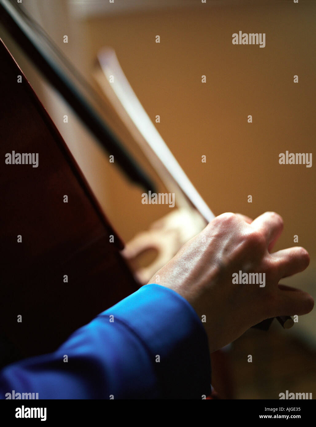 detail of womans hand practice cello at home Stock Photo - Alamy