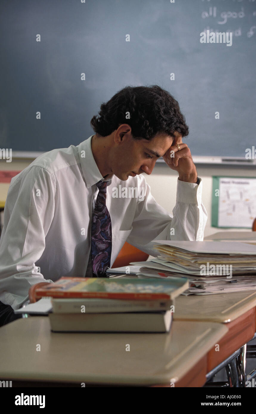 Male teacher teaching in a classroom hi-res stock photography and ...