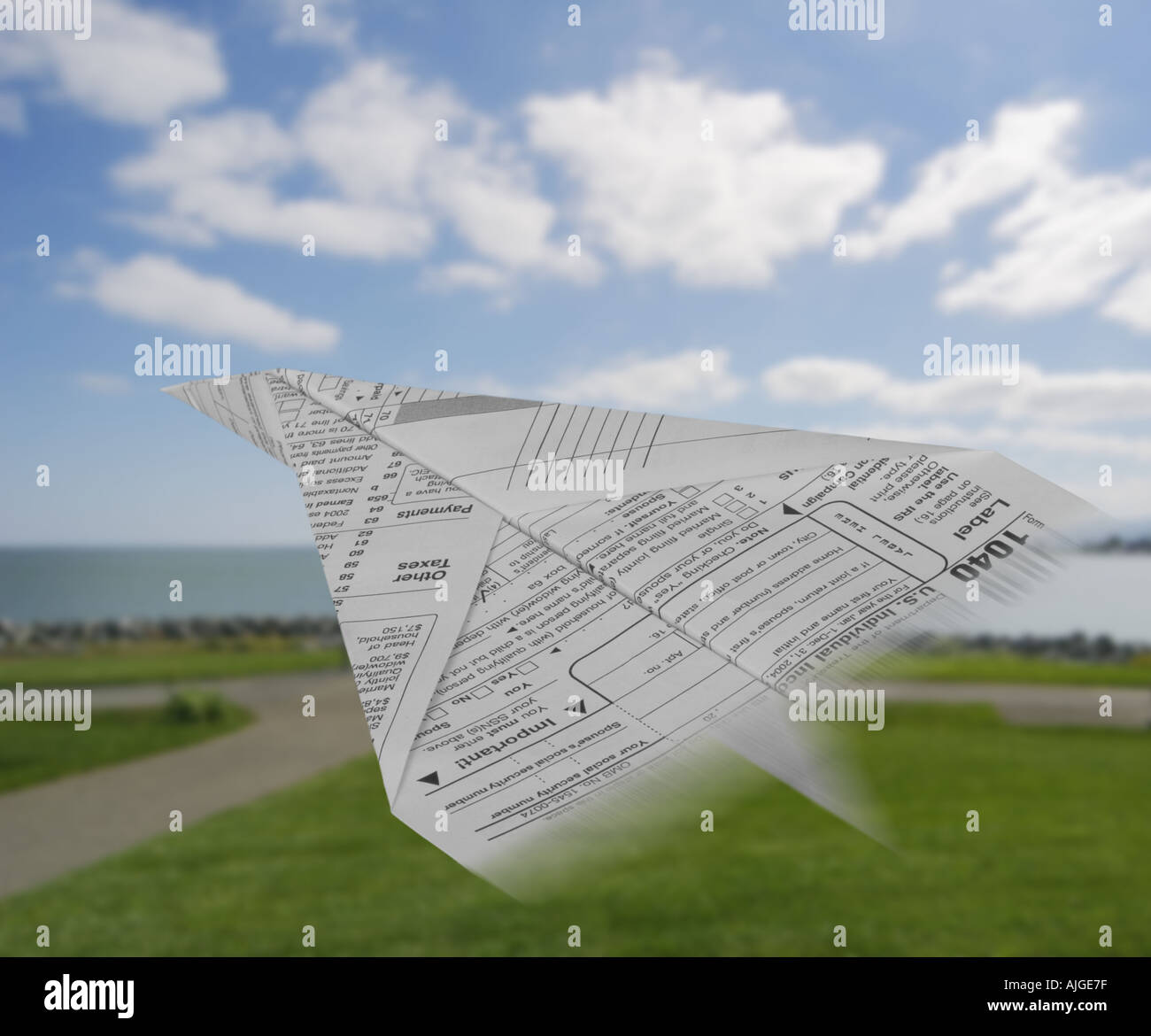 IRS Form 1040 paper airplane flying in the air Stock Photo - Alamy