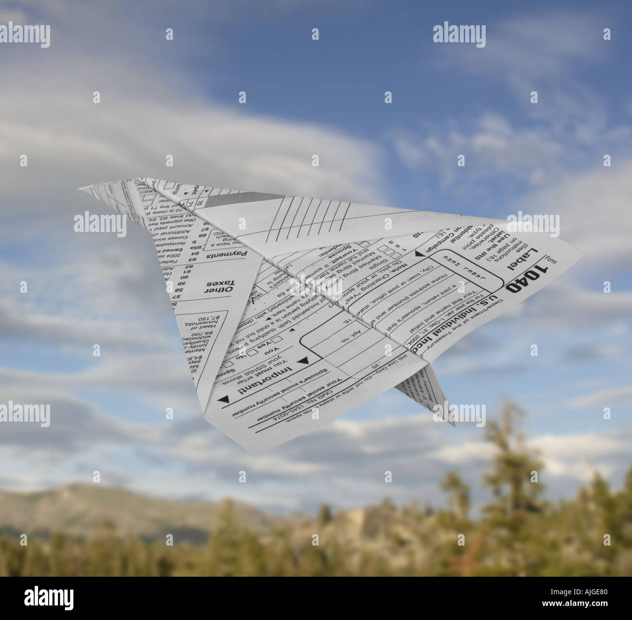 IRS Form 1040 paper airplane flying in the air Stock Photo - Alamy