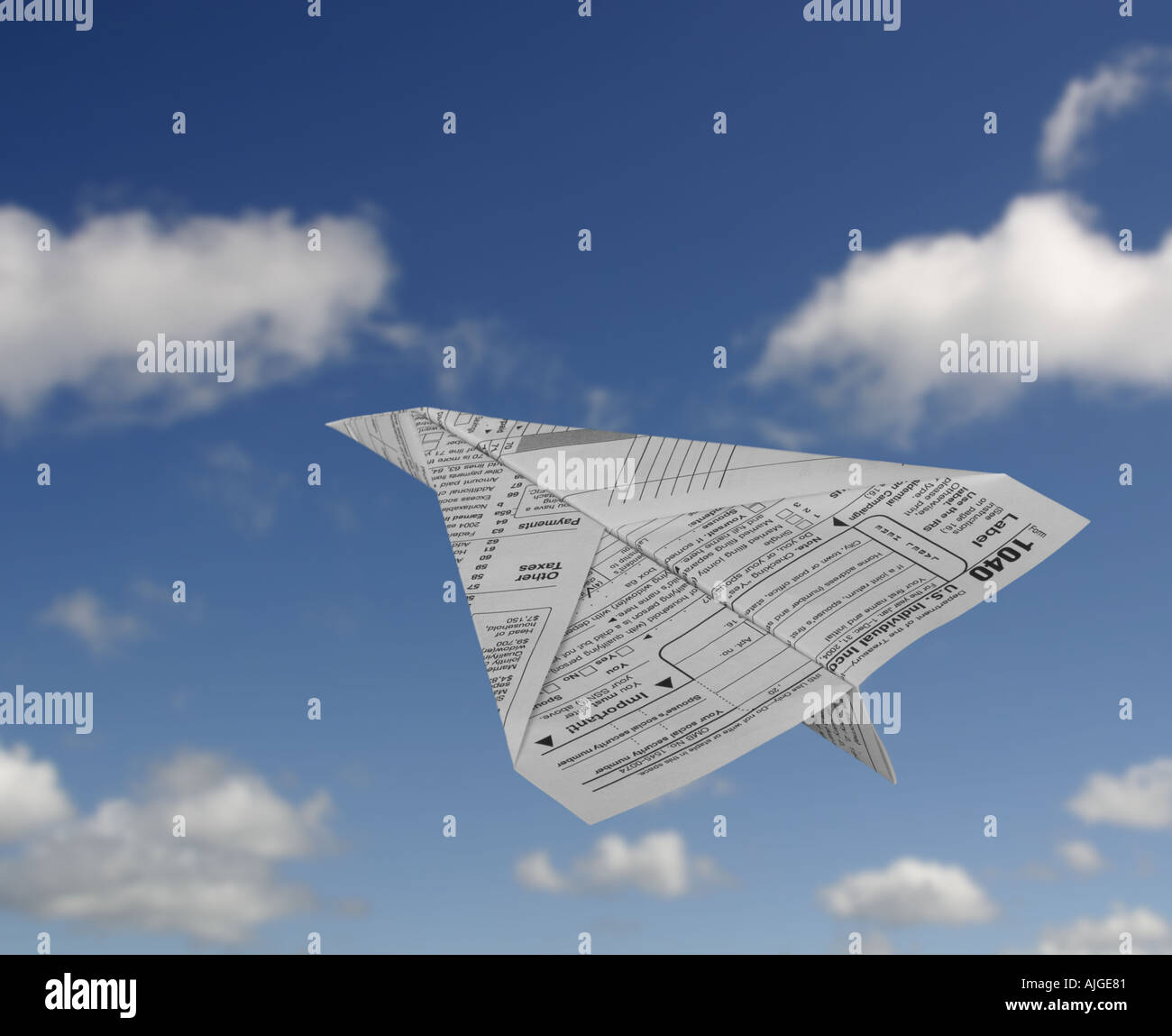 IRS Form 1040 paper airplane flying in the air Stock Photo - Alamy