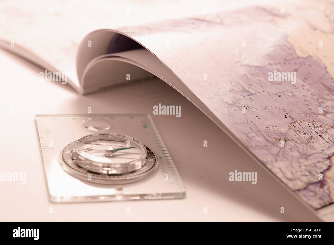 Compass and Atlas Stock Photo - Alamy