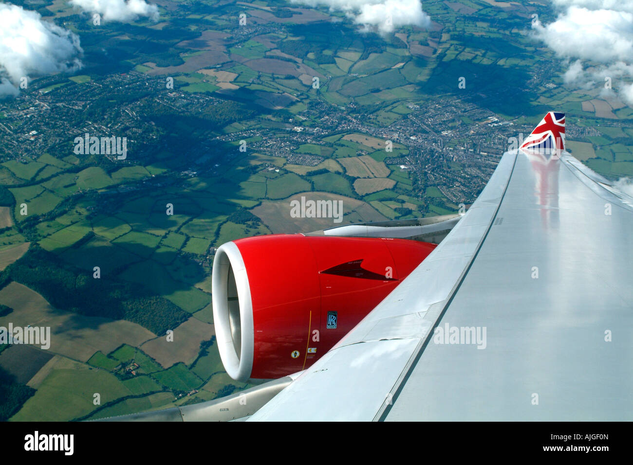Engine and Wing of a A340 600 Airbus Aircraft over English countryside ...