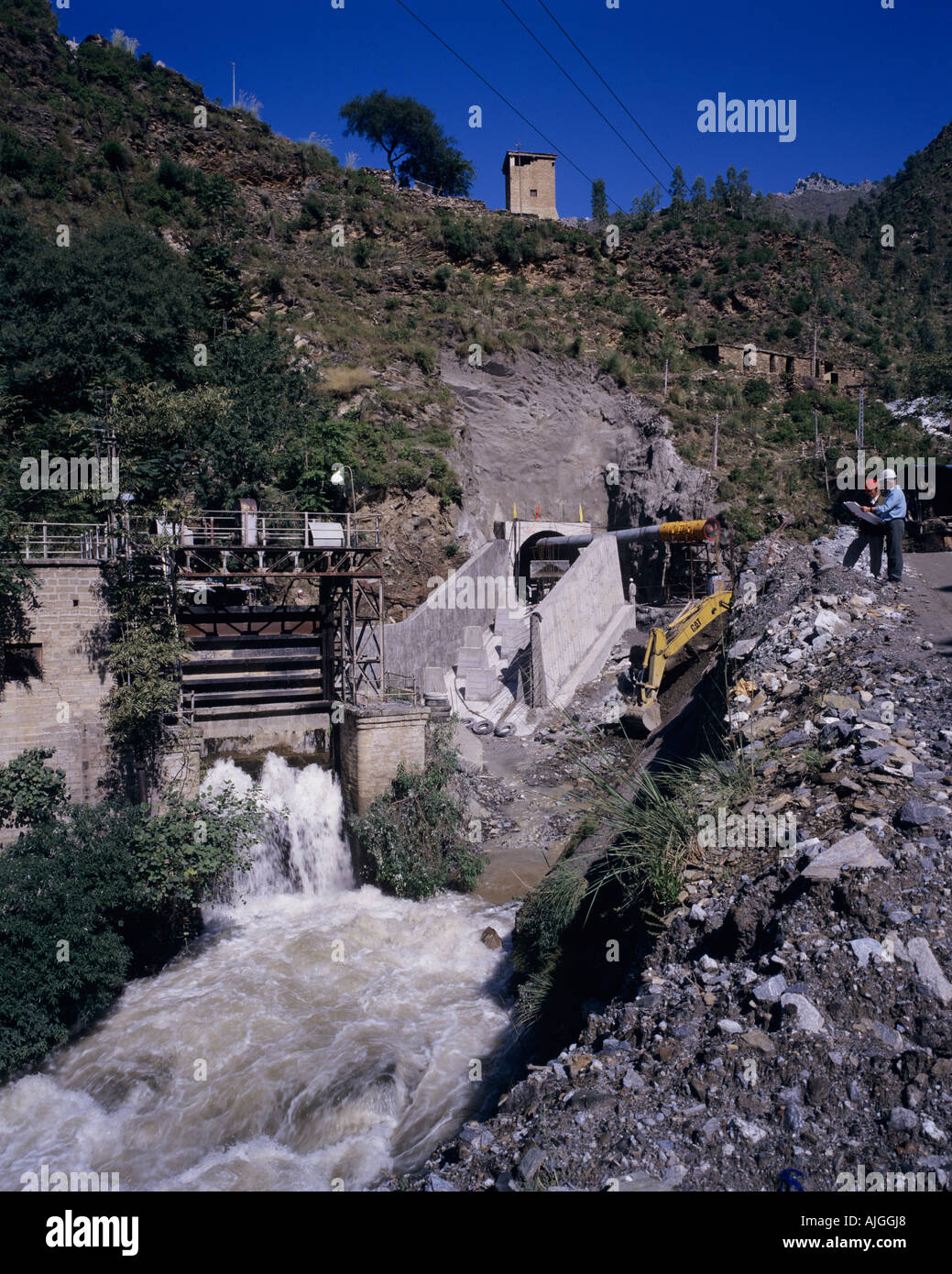 Engineers discussing water project by side of Swat Canal in the Swabi ...