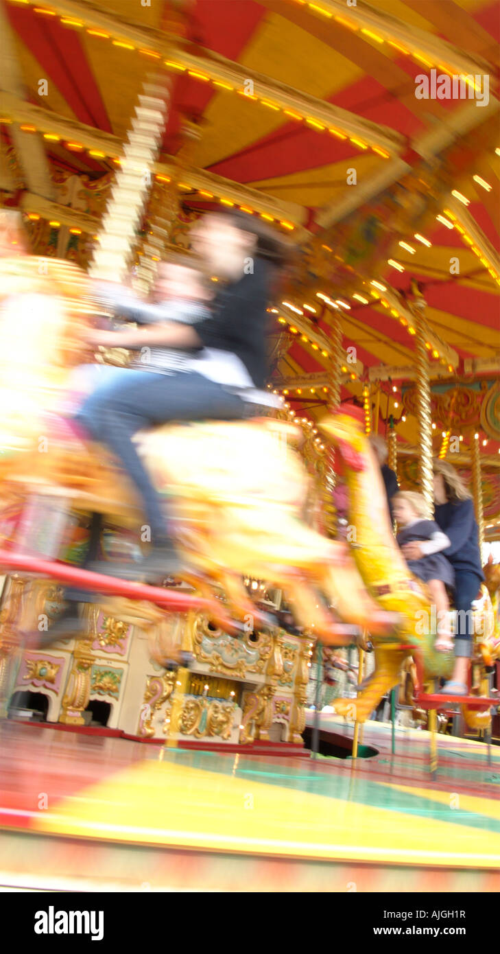 Carousel Merry go round blurr Stock Photo - Alamy