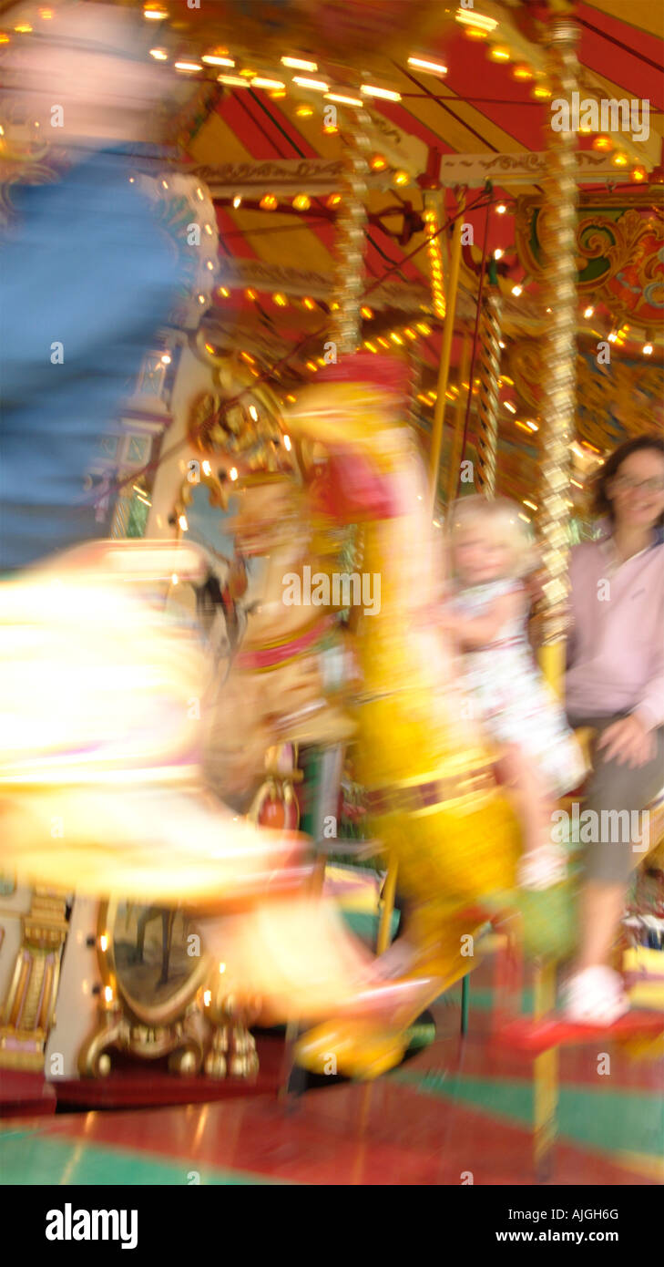 Carousel Merry go round blurr Stock Photo - Alamy