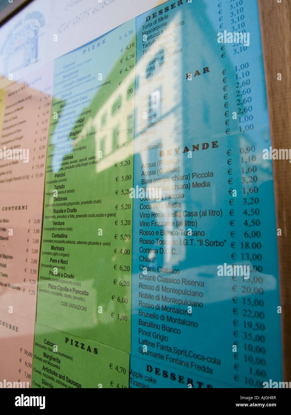 Building reflection contrasts with restaurant menu Stock Photo - Alamy