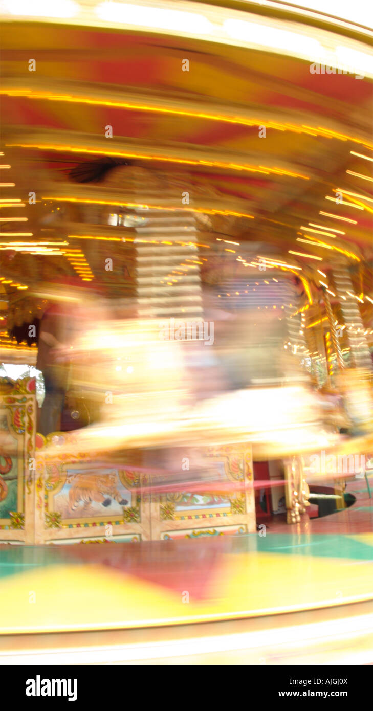 Carousel Merry go round blurr Stock Photo - Alamy
