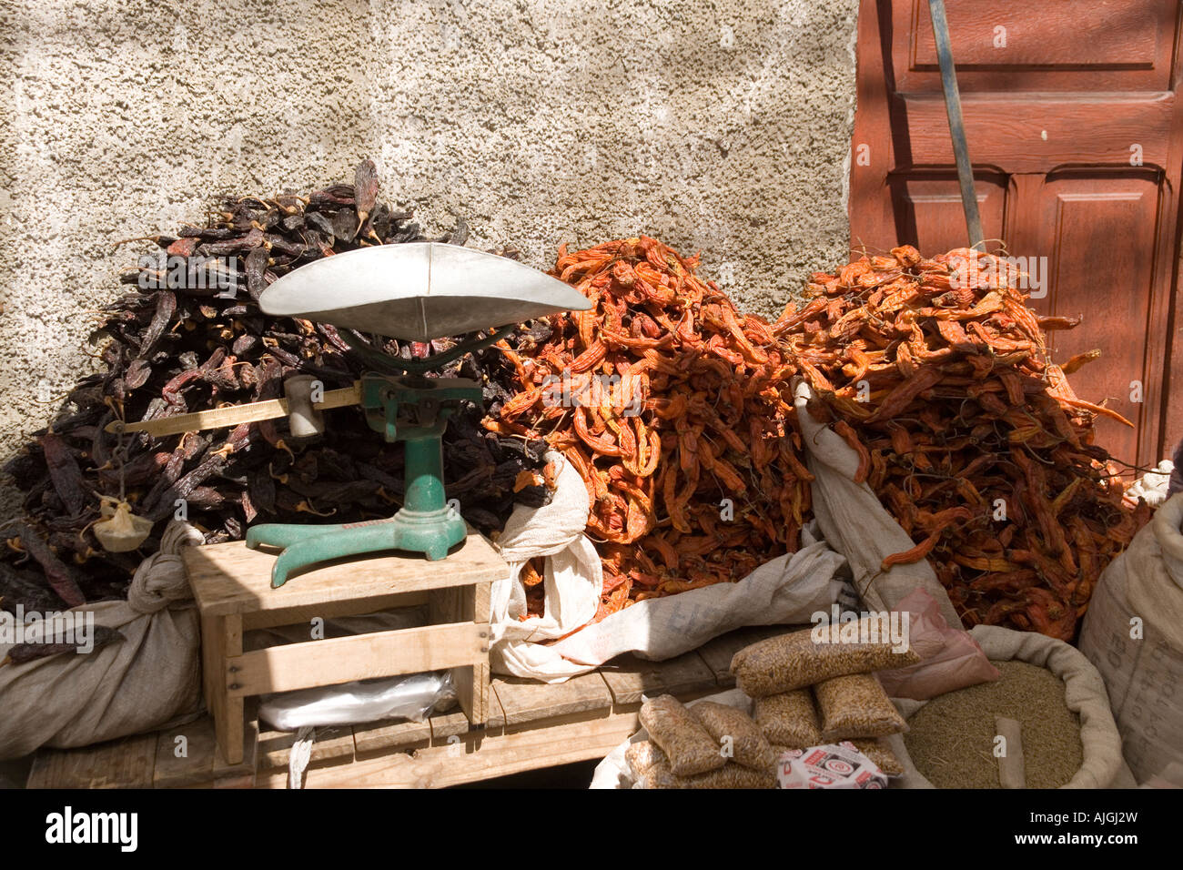Aymara people and a food stall in the market district of La Paz ...