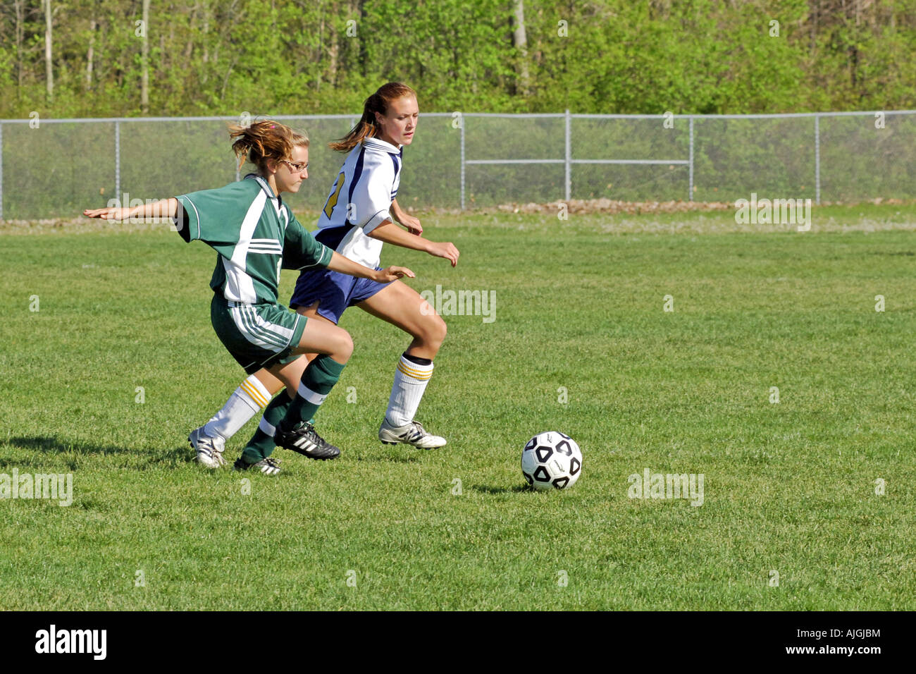 Teenage girls involved in High School Soccer action Stock Photo - Alamy