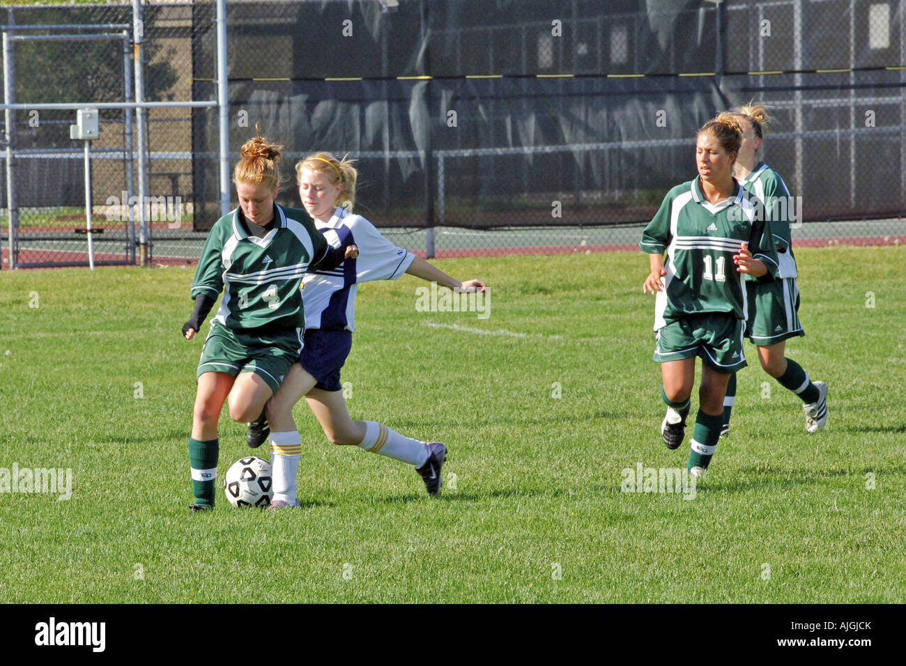 Teenage girls involved in High School Soccer action Stock Photo - Alamy